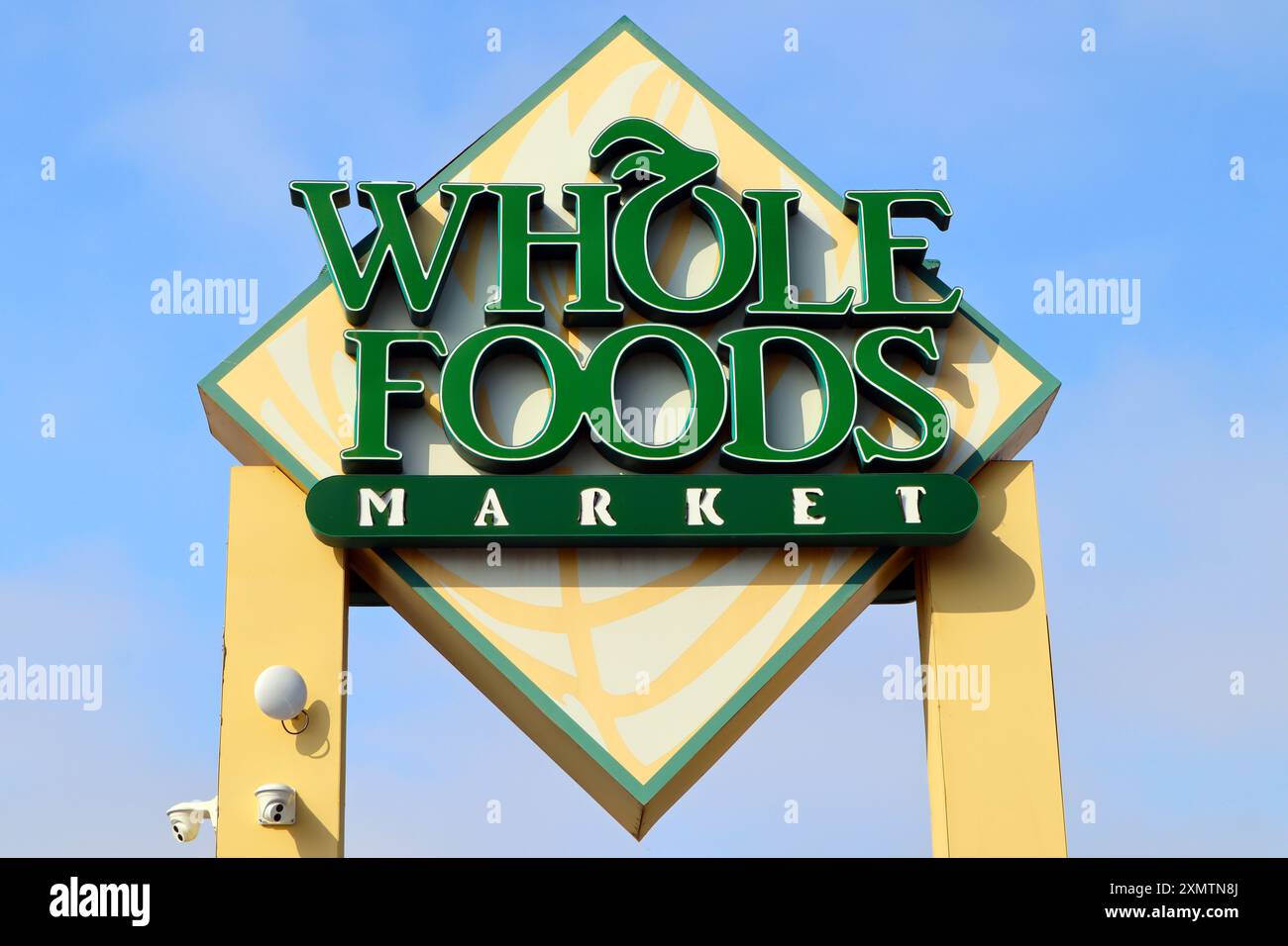Whole Foods Market sign, a subsidiary of Amazon, American multinational ...