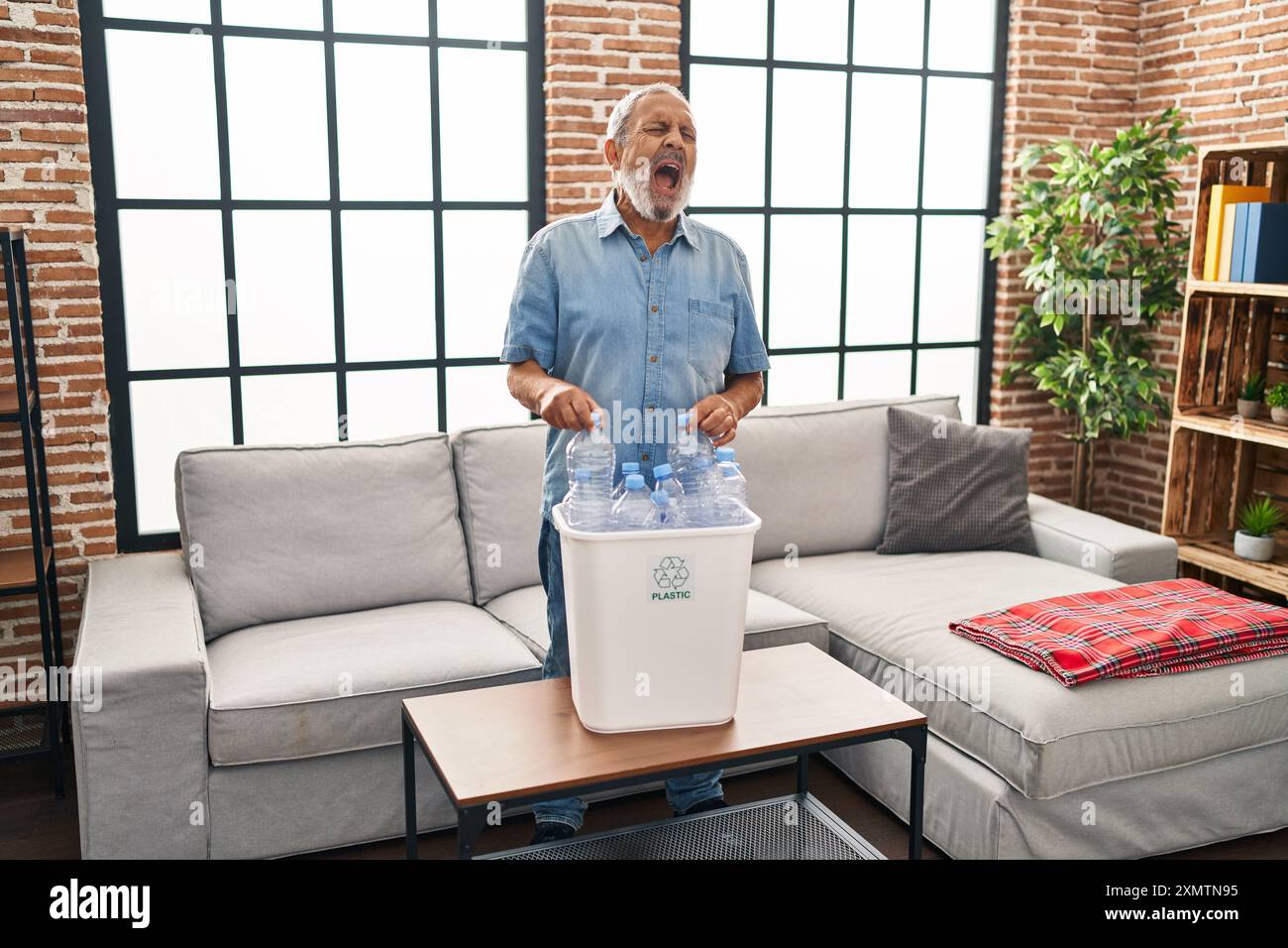 Furious senior man frustrated by recycling regime, aggressive scene of ...