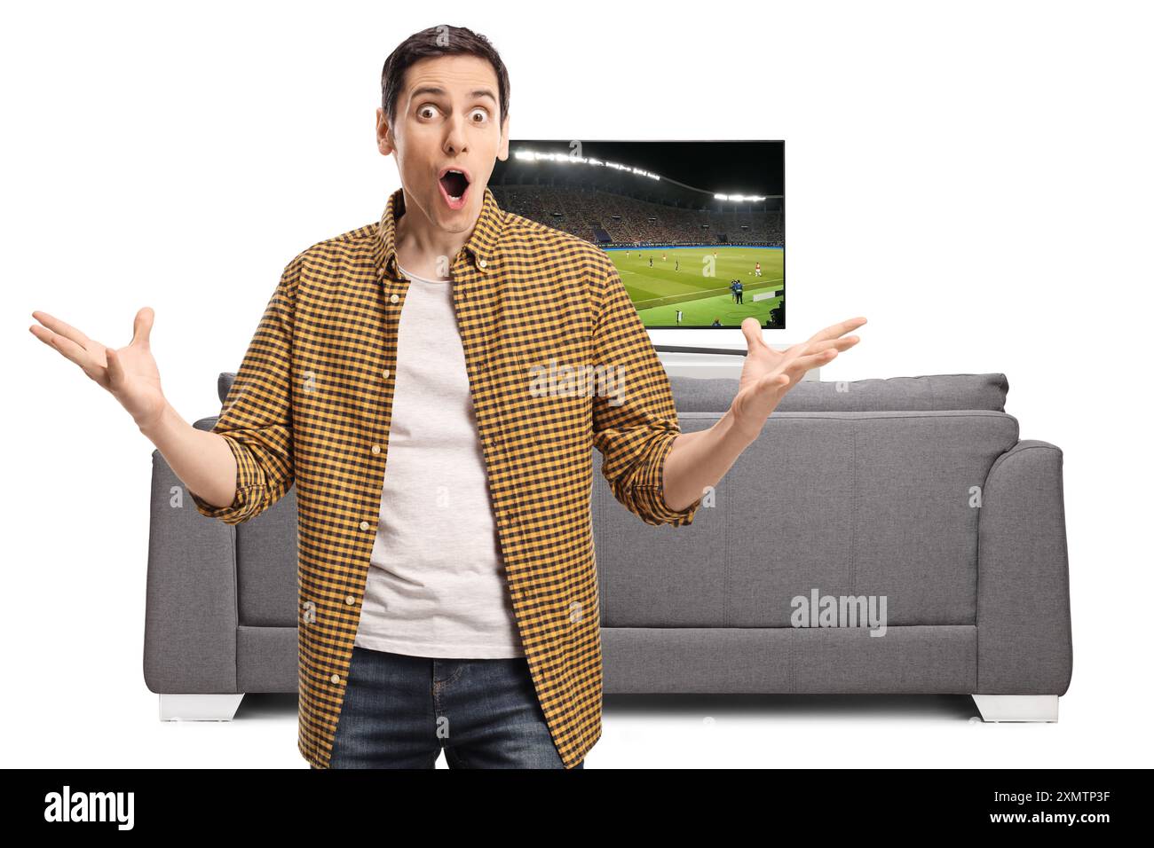 Surprised young man in front of a tv with football match isolated on ...