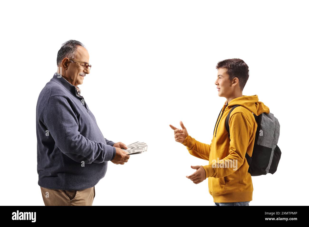 Mature man giving money to a male teenager isolated on white background ...