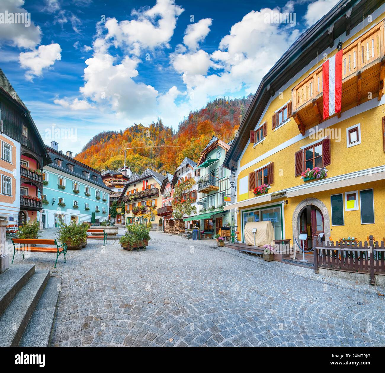 Stunning view on central square of famous Hallstatt mountain village ...
