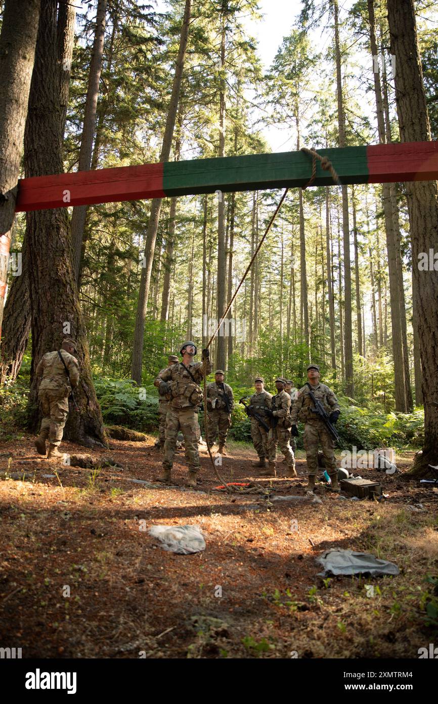 U.S. Army National Guard officer candidates navigate an obstacle at the ...