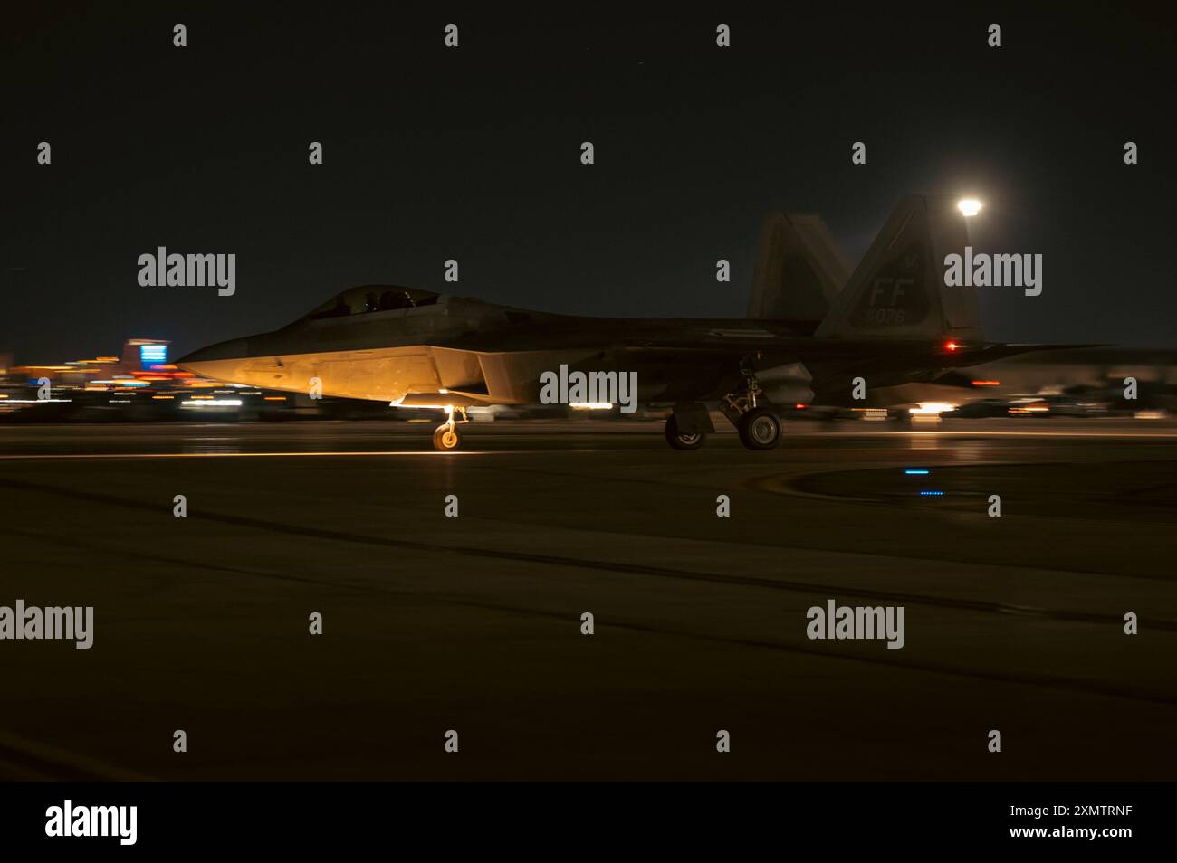 An F-22 Raptor from the 1st Fighter Wing sits on the flight line during ...