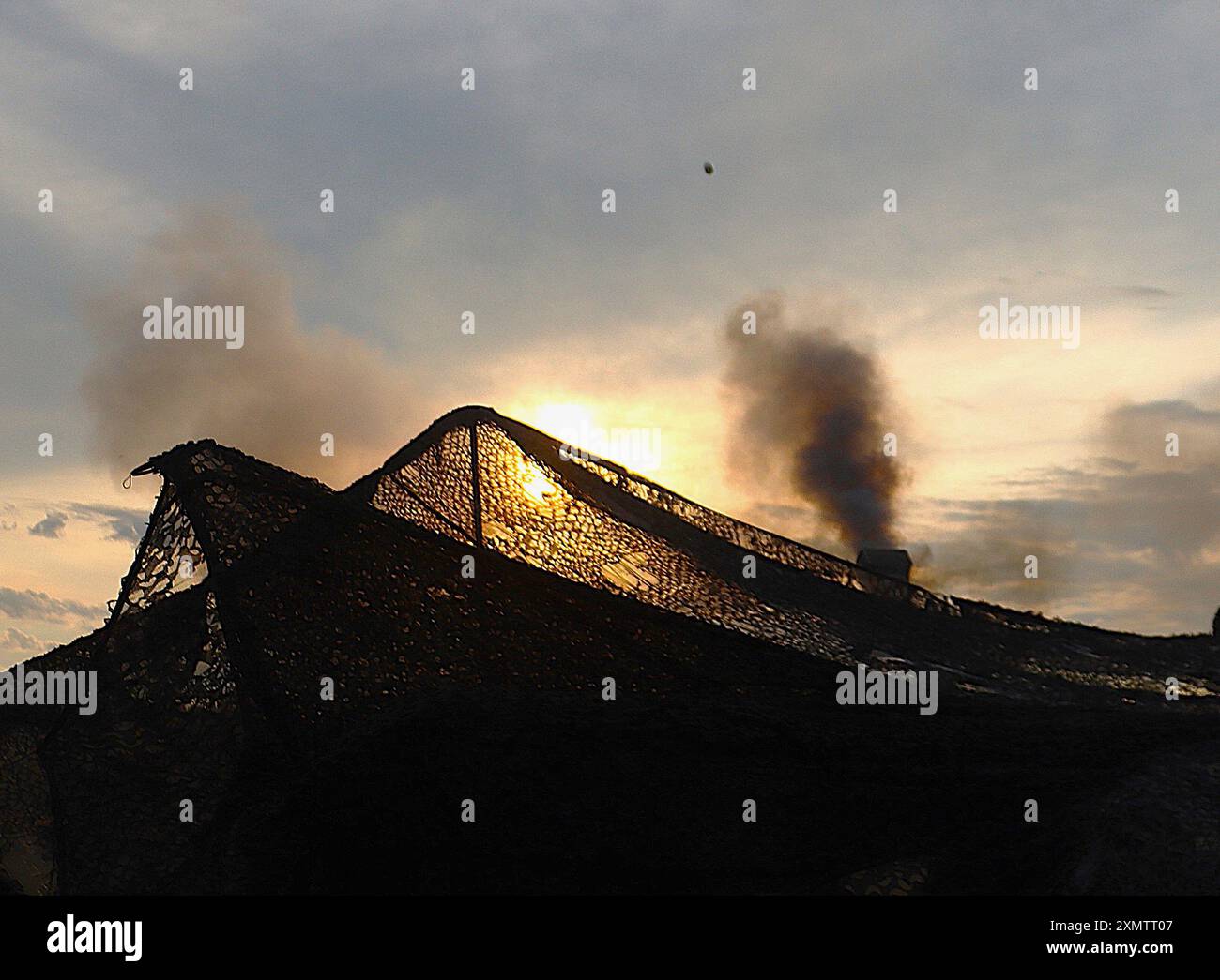 From under Camouflaged Gun batteries against the setting sun, Golf ...