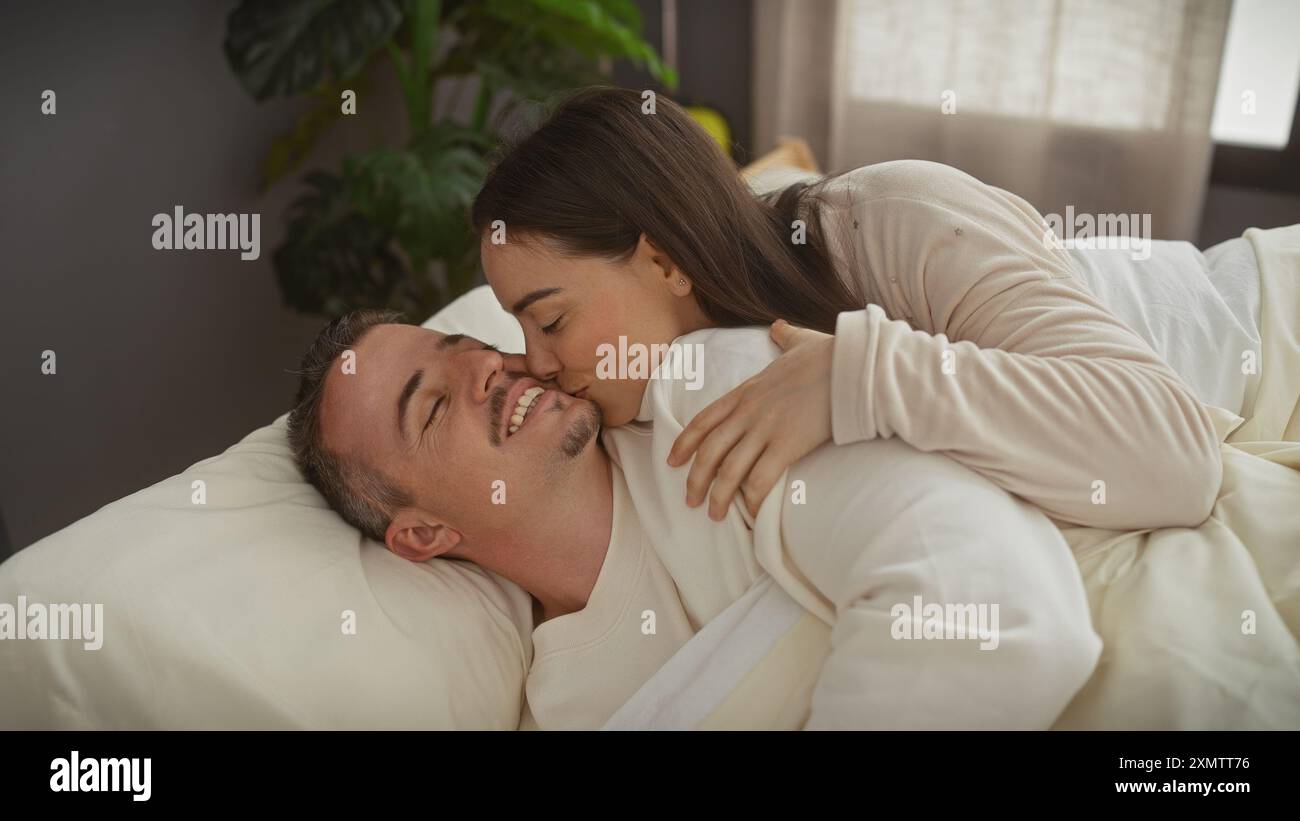 A loving couple shares an affectionate moment together in the comfort ...