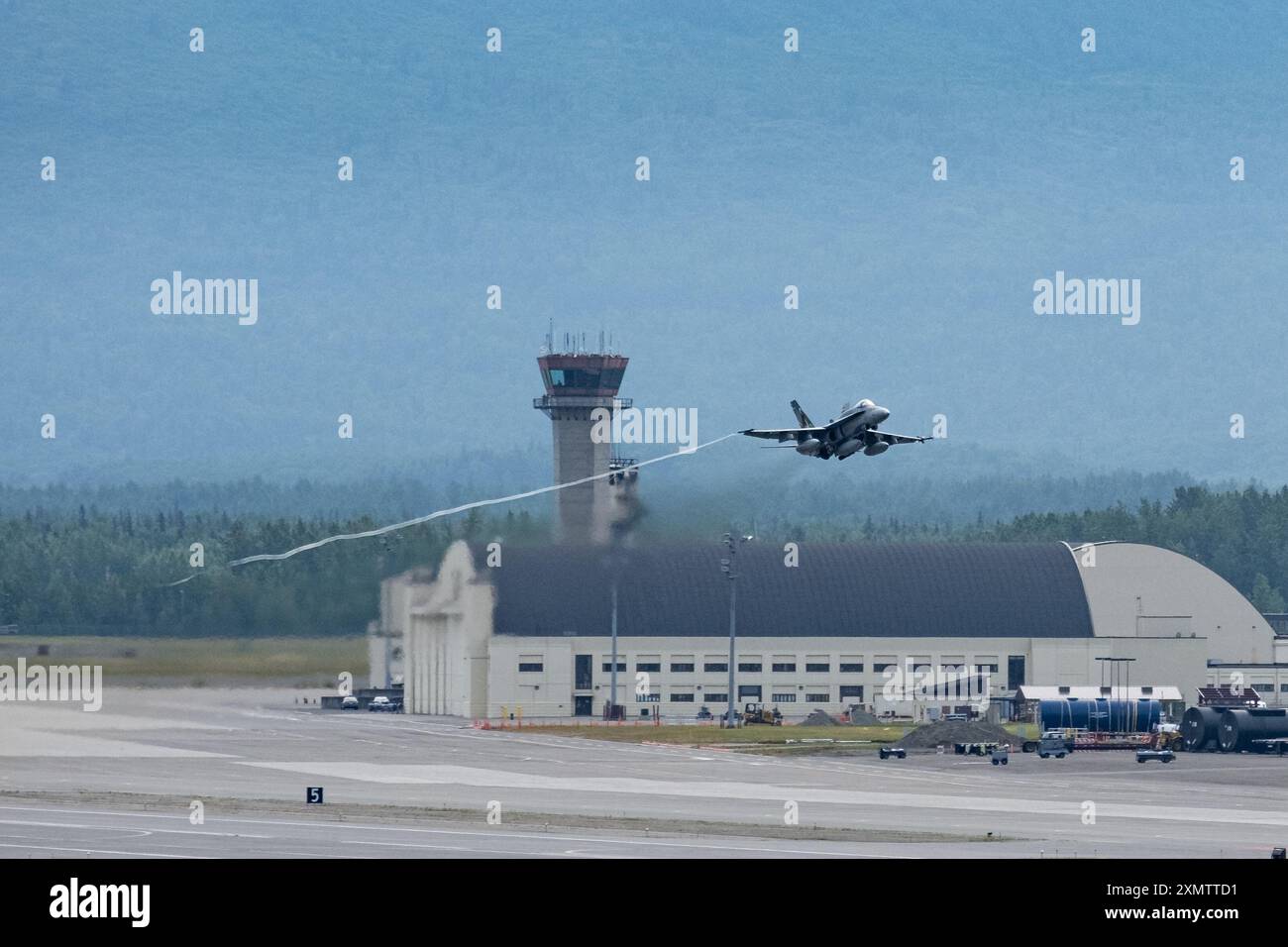 A North American Aerospace Defense Command CF-18 Hornet takes off from ...