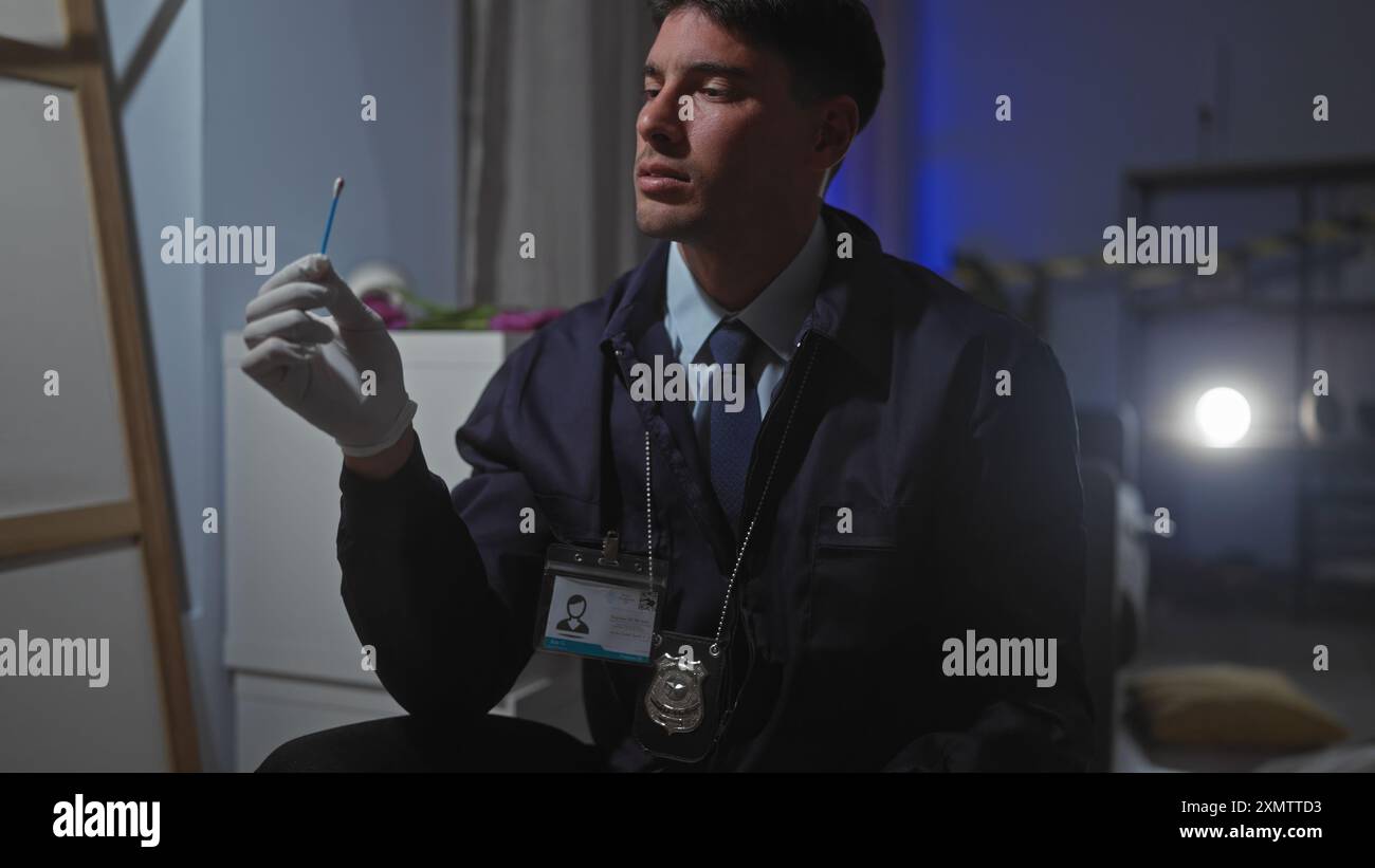 A young hispanic male detective in a crime scene indoors examining ...