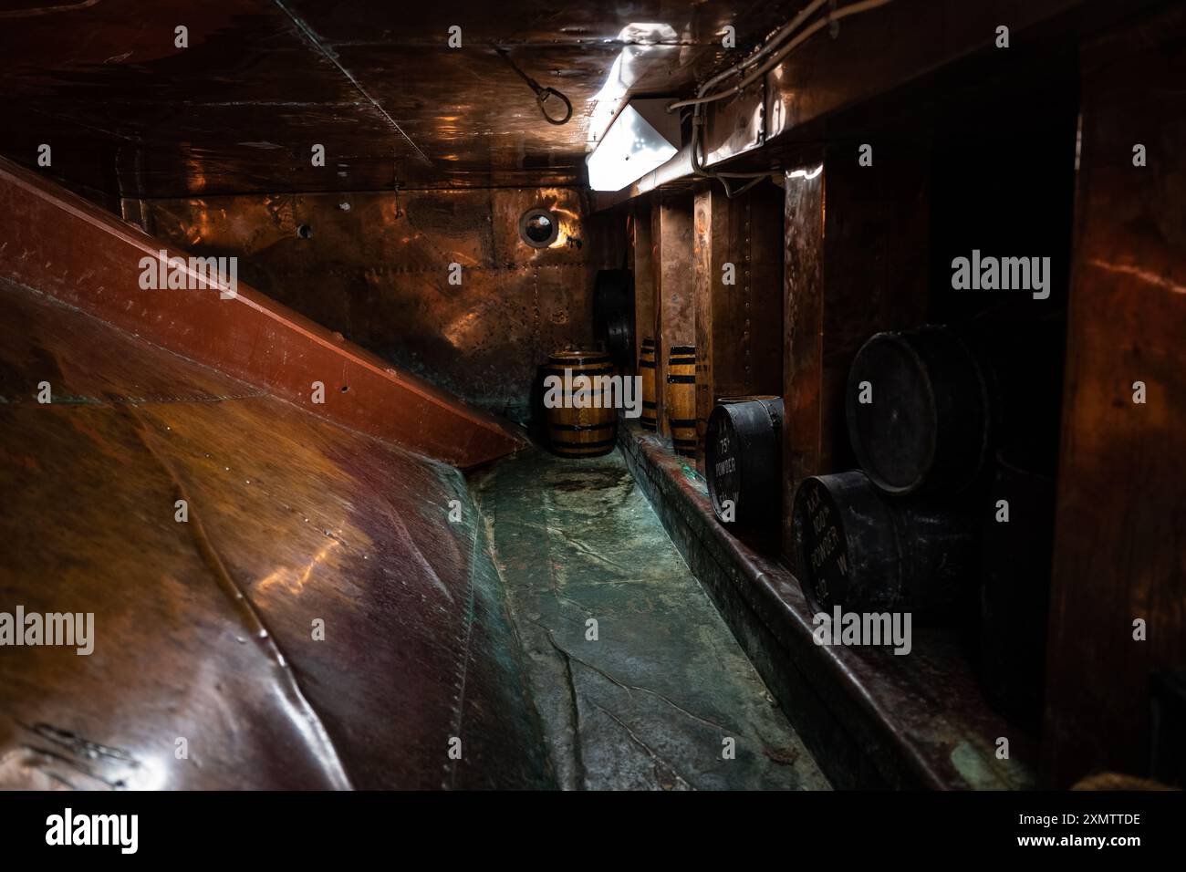 Empty barrels of gunpowder are on display in the aft magazine aboard ...