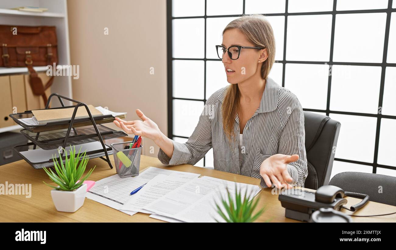 A professional young woman engages in an animated conversation in a ...