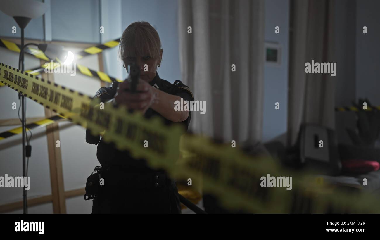 Focused woman police officer aiming gun in crime scene indoors with ...