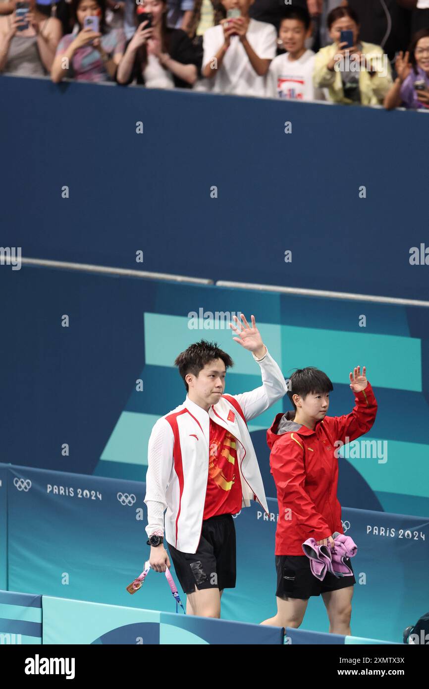 (240729) -- PARIS, July 29, 2024 (Xinhua) -- Wang Chuqin (L)/Sun Yingsha of China react after ...