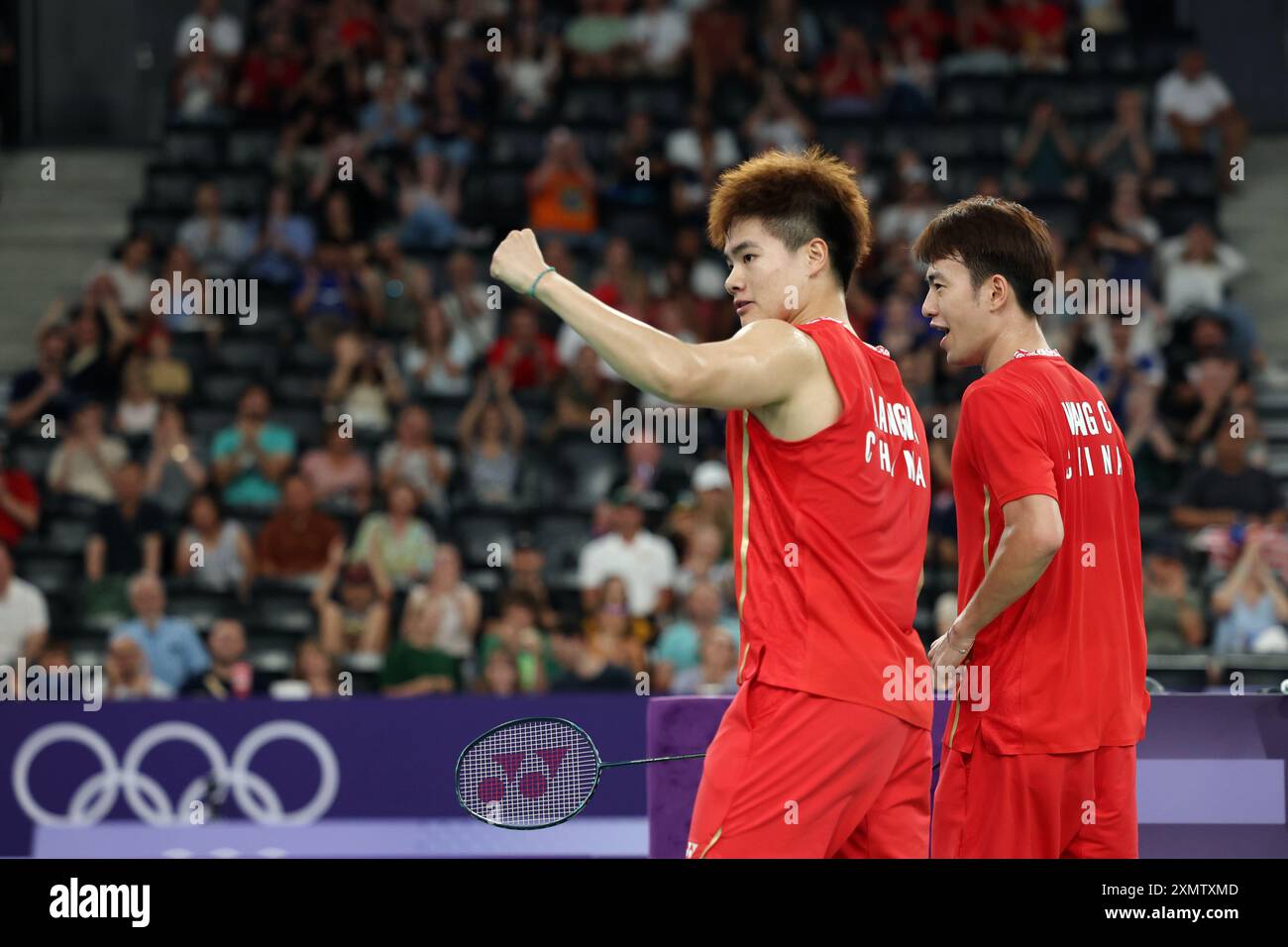Paris, France. 29th July, 2024. Liang Weikeng/Wang Chang of China react during the badminton men ...