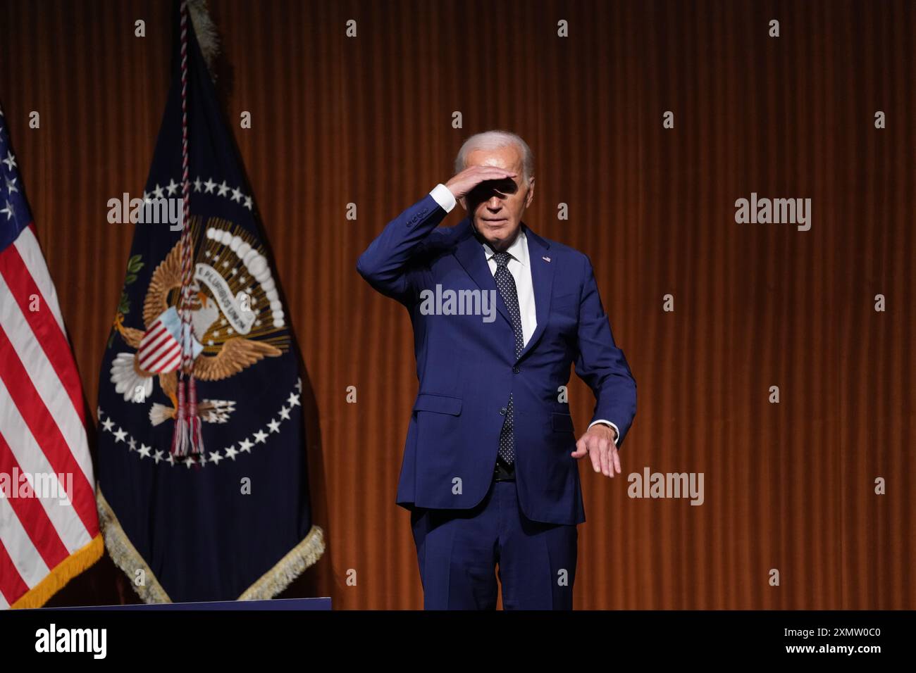 U.S. President JOE BIDEN leaves the stage after giving the keynote ...