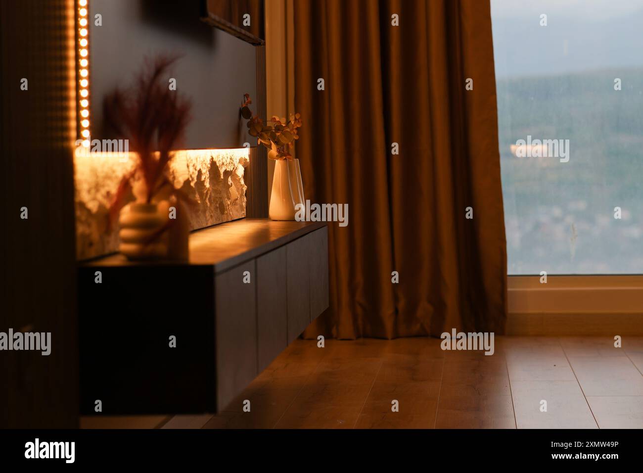 modern floating TV media console dark room ambient LED light Stock ...