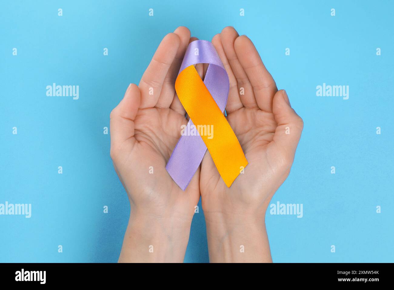 World Psoriasis Day. Woman with orange and orchid ribbon as symbol of ...