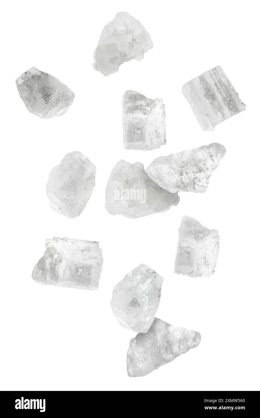 Sea salt crystals in air on white background Stock Photo - Alamy