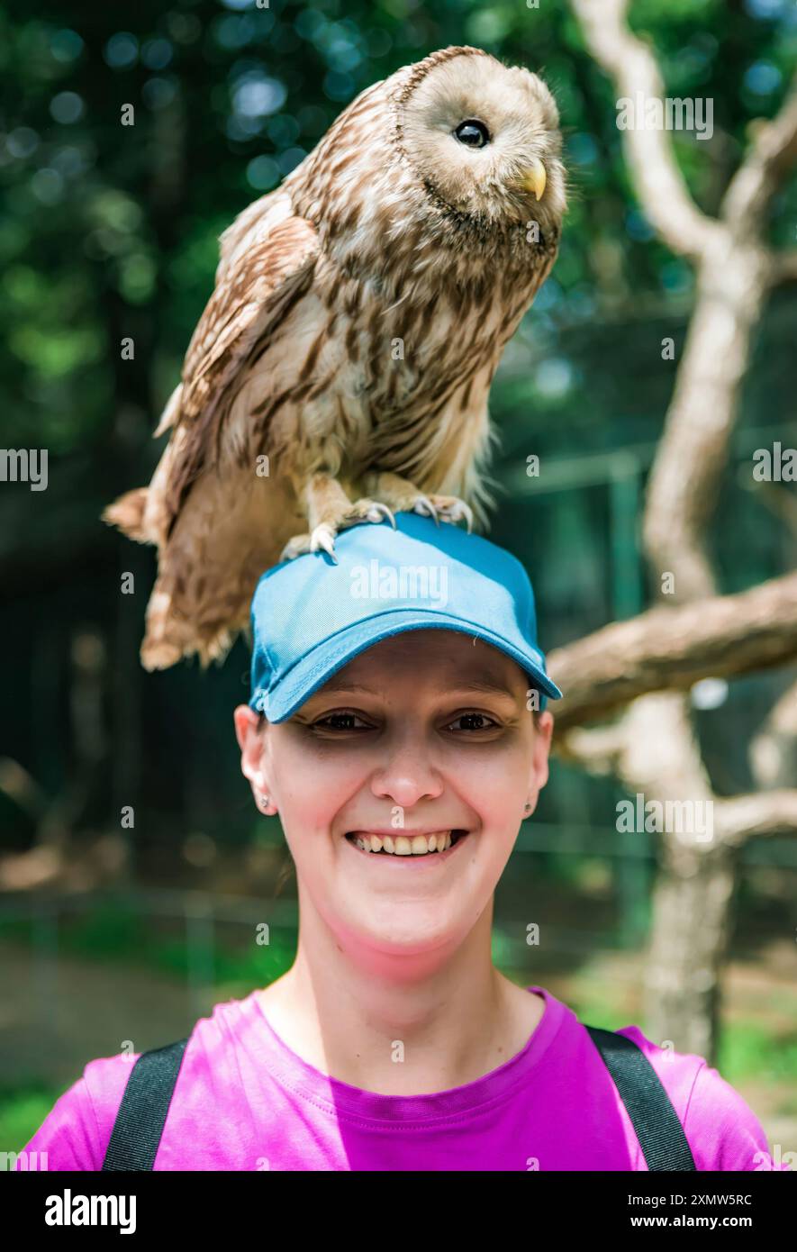 Portrait of laughing 36 years old Russian woman with Ural owl (Strix ...