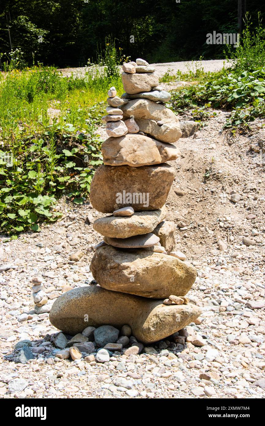 Stones piled on top of each other forming a tower. Stacks of stones on ...