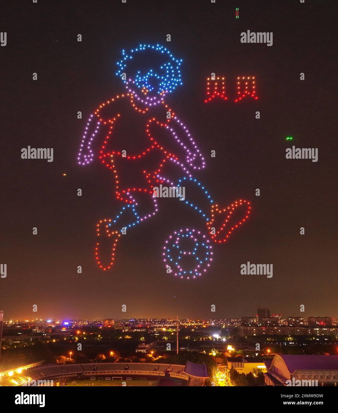 A drone show celebrating Chinese athlete Sheng Lihao winning gold ...