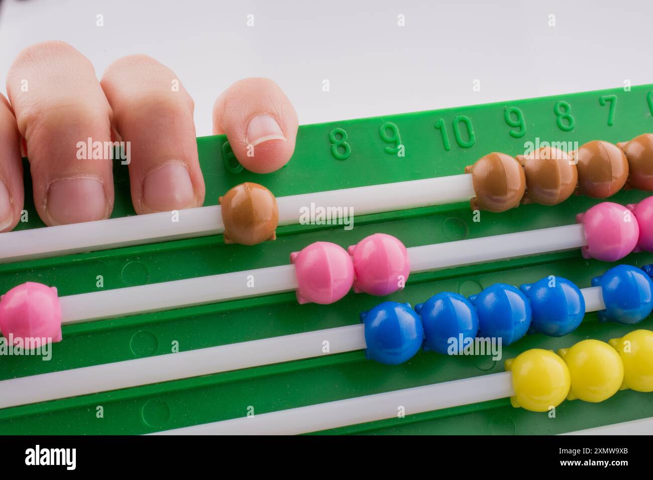 Hand using a color abacus Stock Photo - Alamy