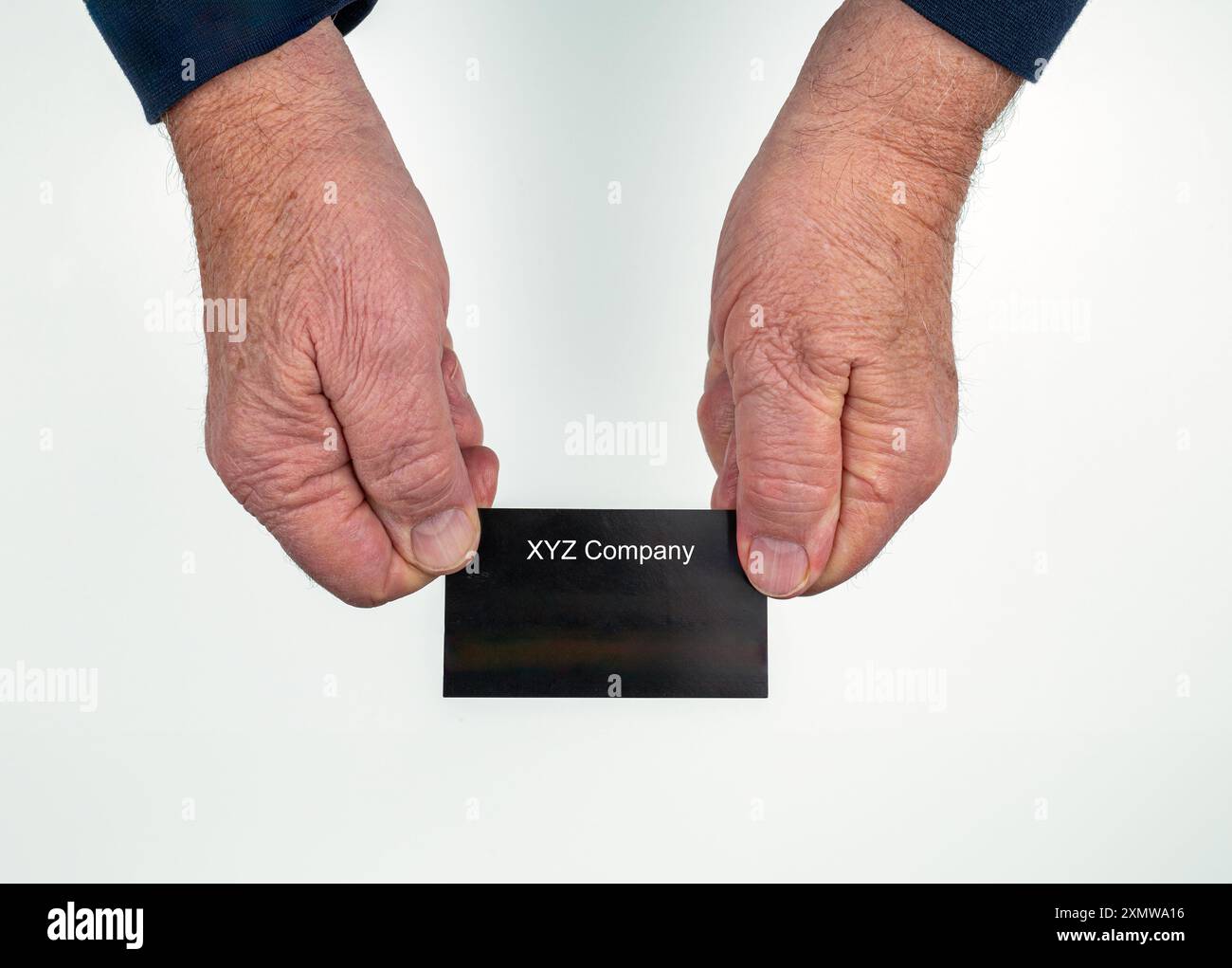 Business card in mans hand hi-res stock photography and images - Alamy