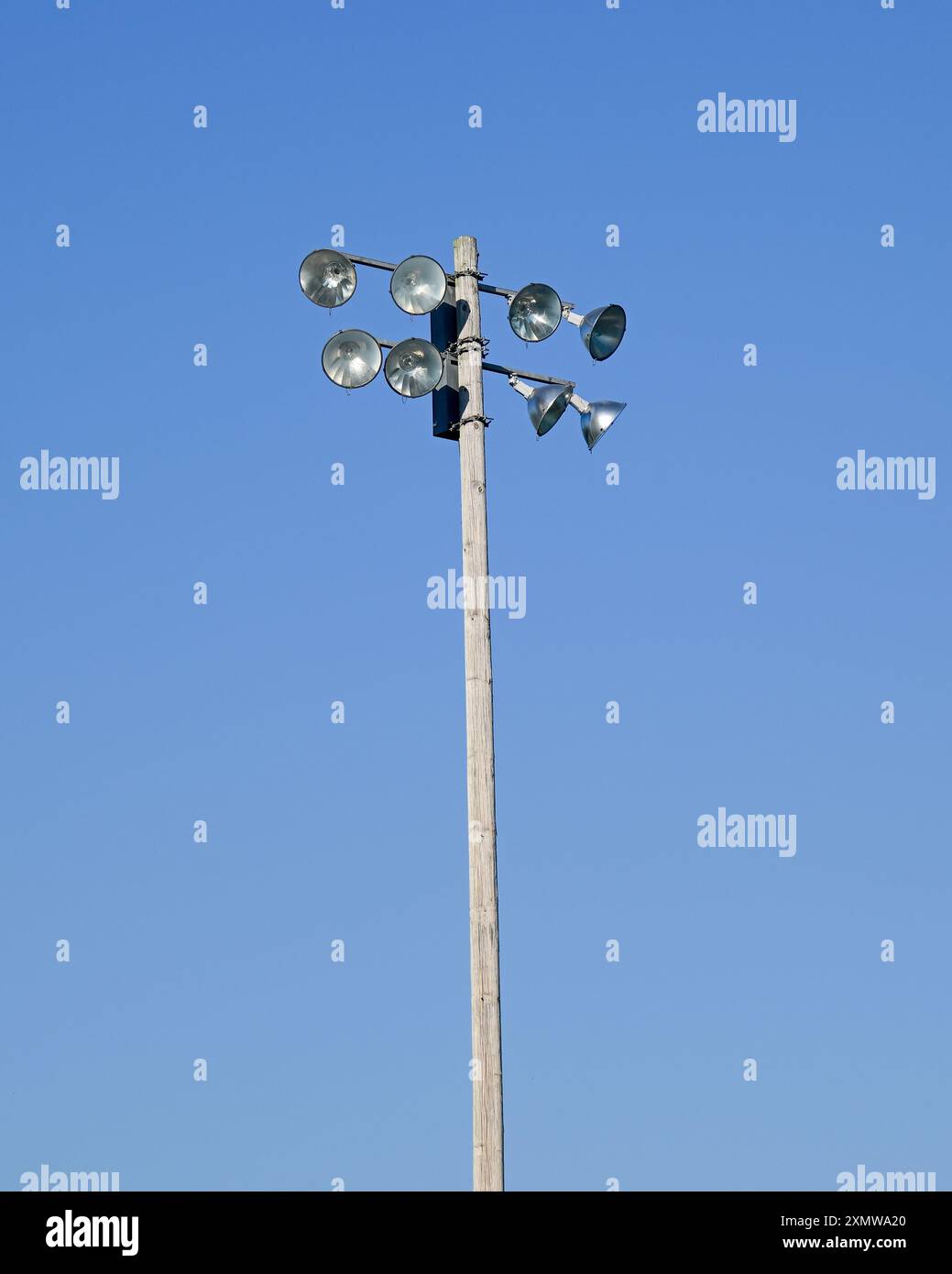 Baseball field light pole against a clear blue sky Stock Photo - Alamy