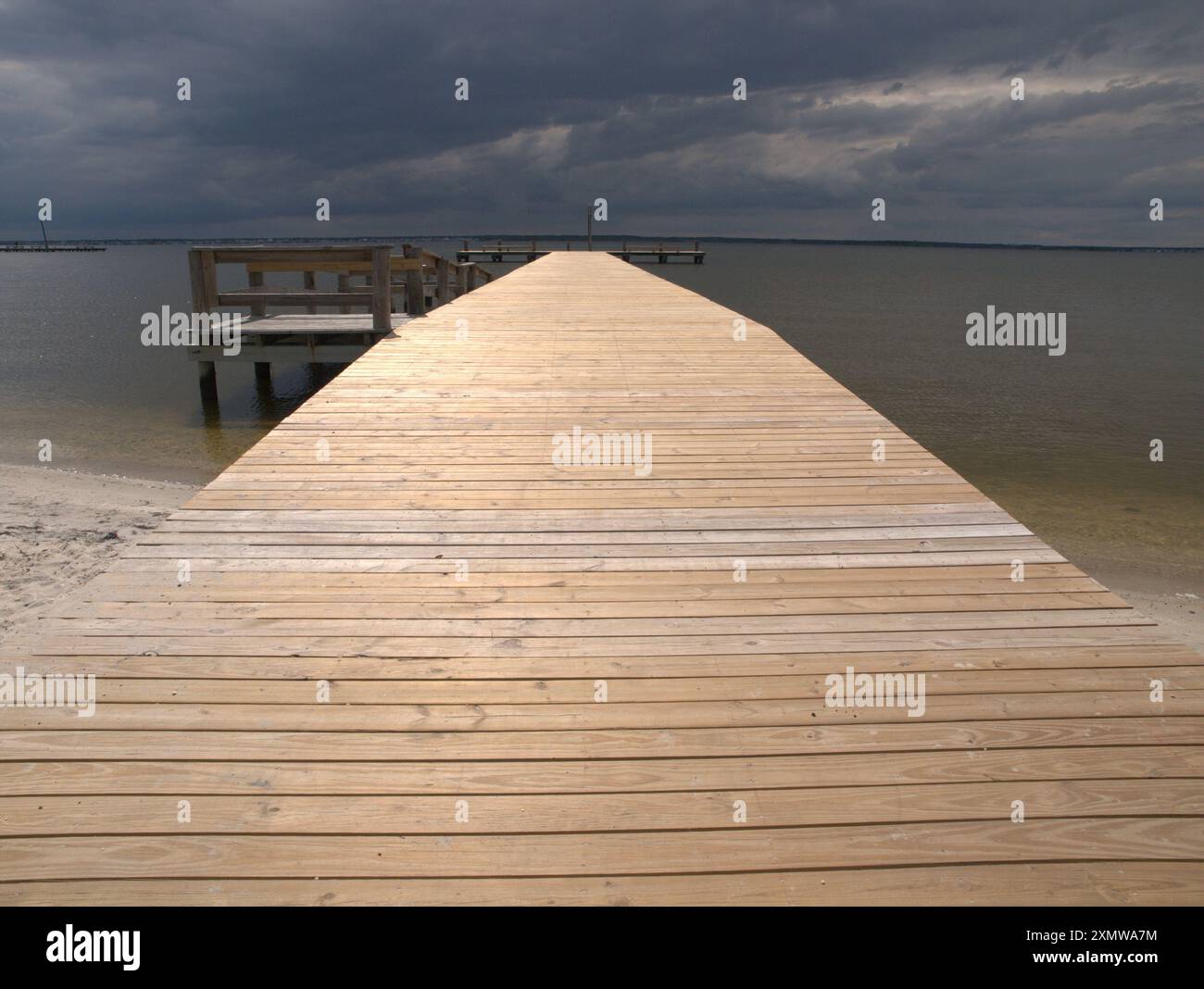 Flat long wooden dock extending out into Barnegat Bay, New Jersey, USA ...