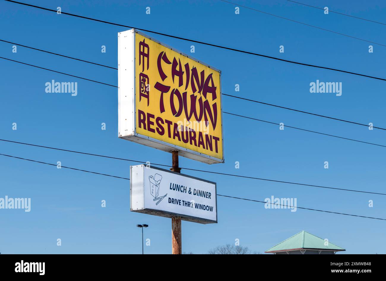 China Town, Chinese restaurant signs, on a pole, are isolated on blue ...