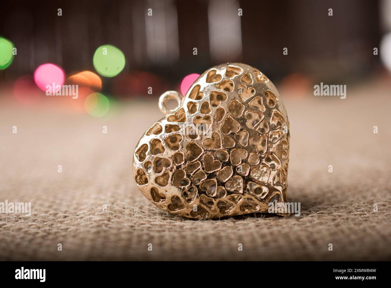 Christmas lights behind heart shaped object Stock Photo - Alamy