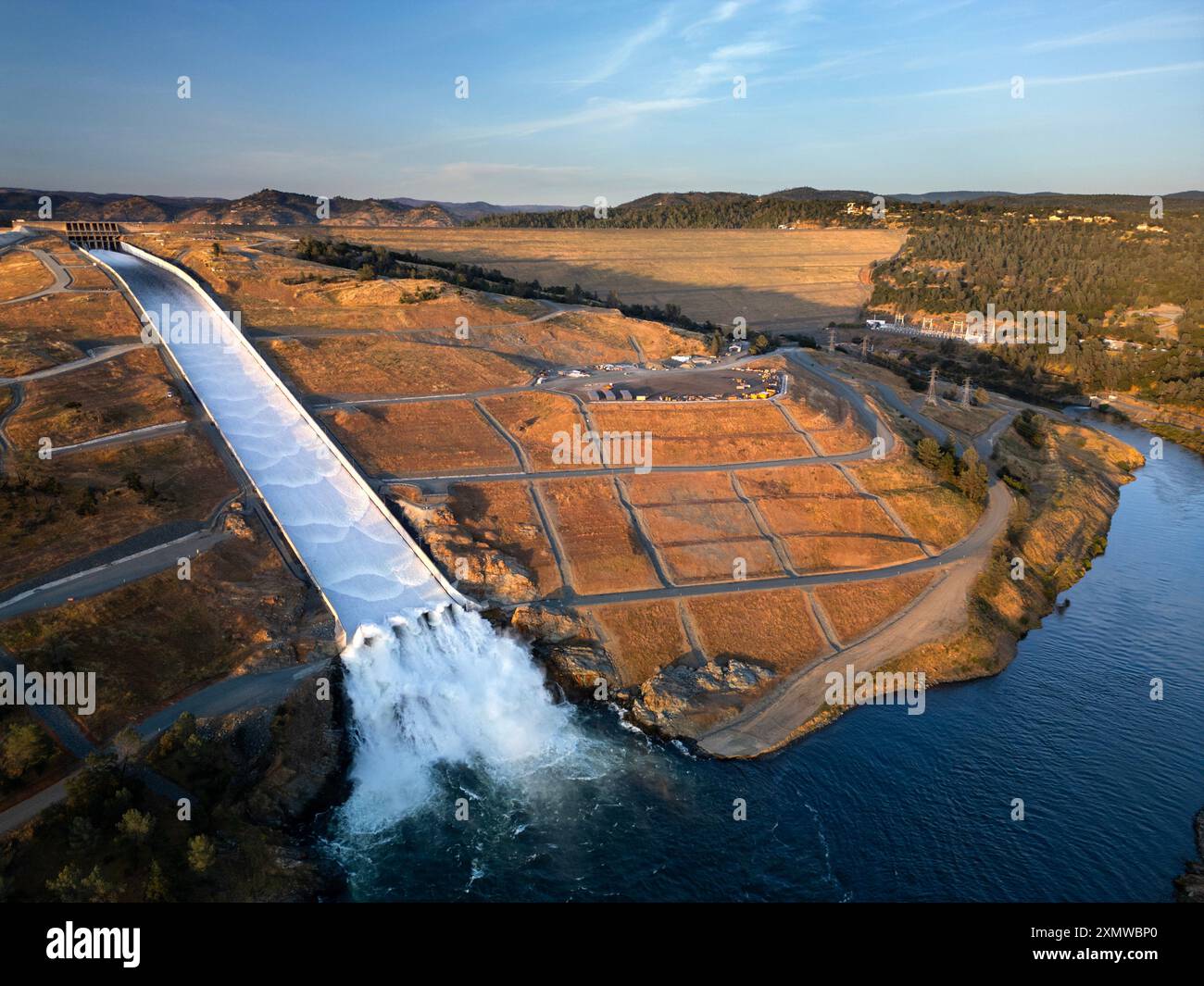Aerial view of the Lake Oroville Dam with the new spillway in action ...