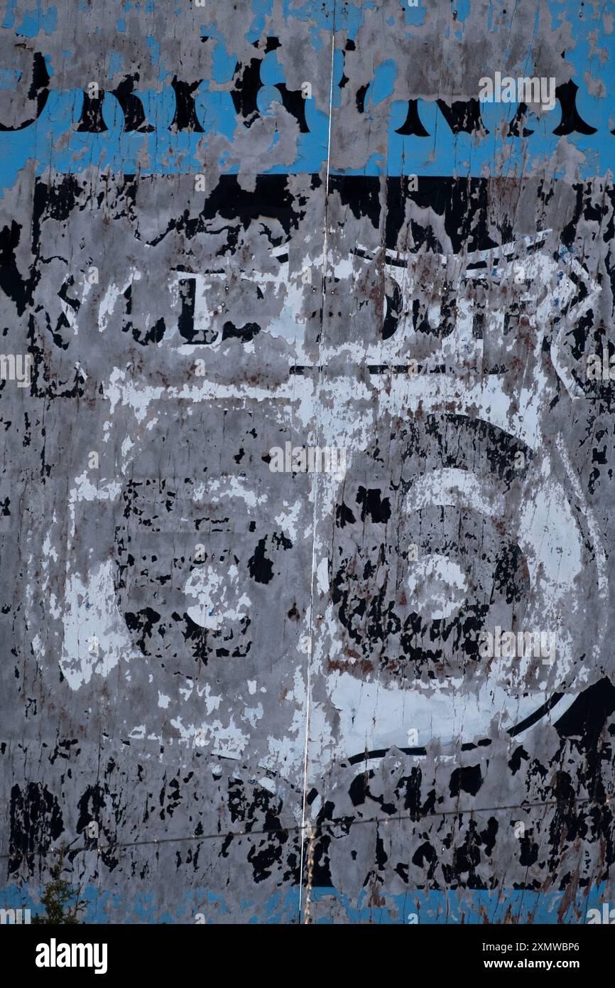 An old beat-up weathered painted sign along Route 66 in New Mexico ...