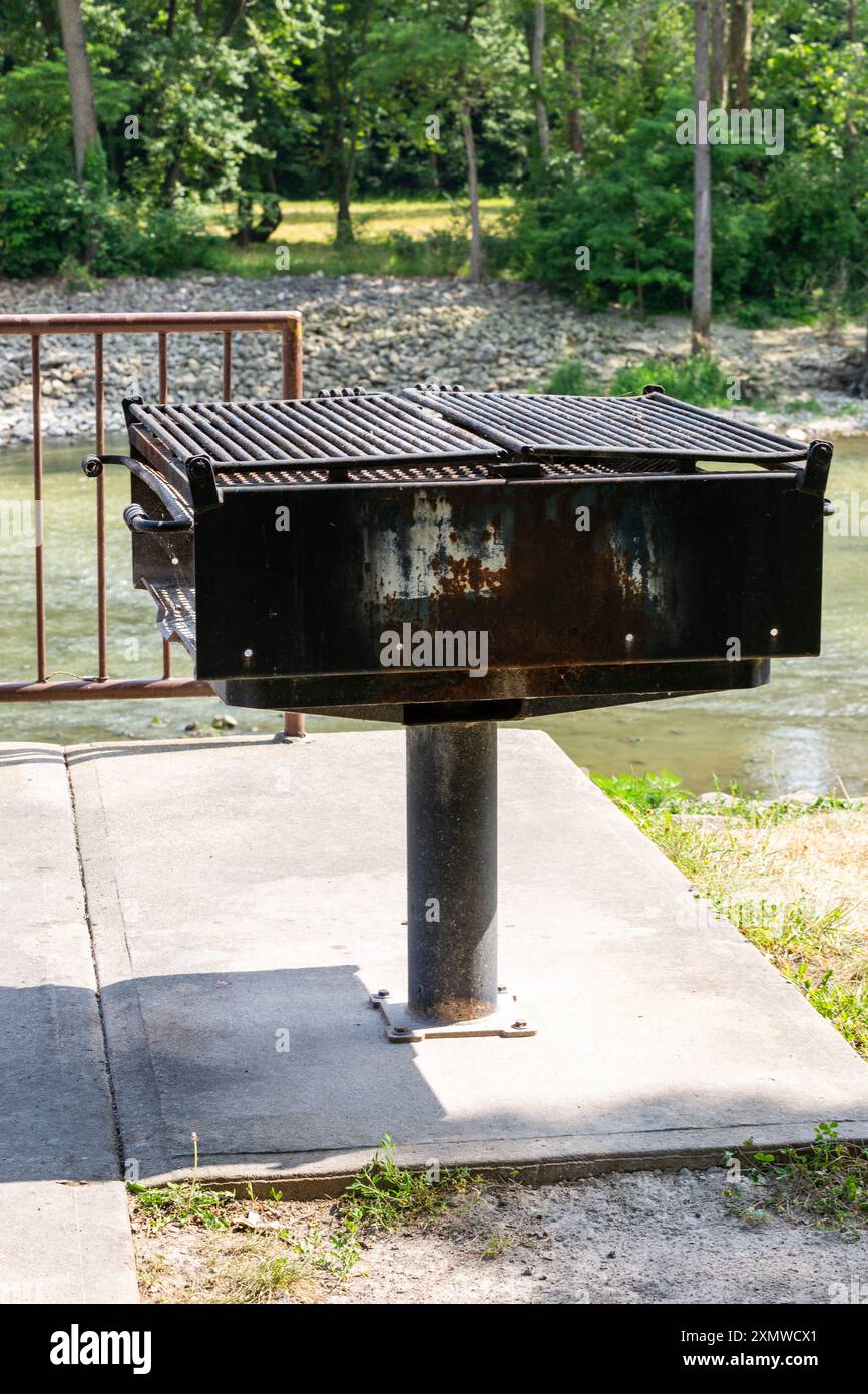 A charcoal grill stands along the Wabash River in the Arrowhead North ...
