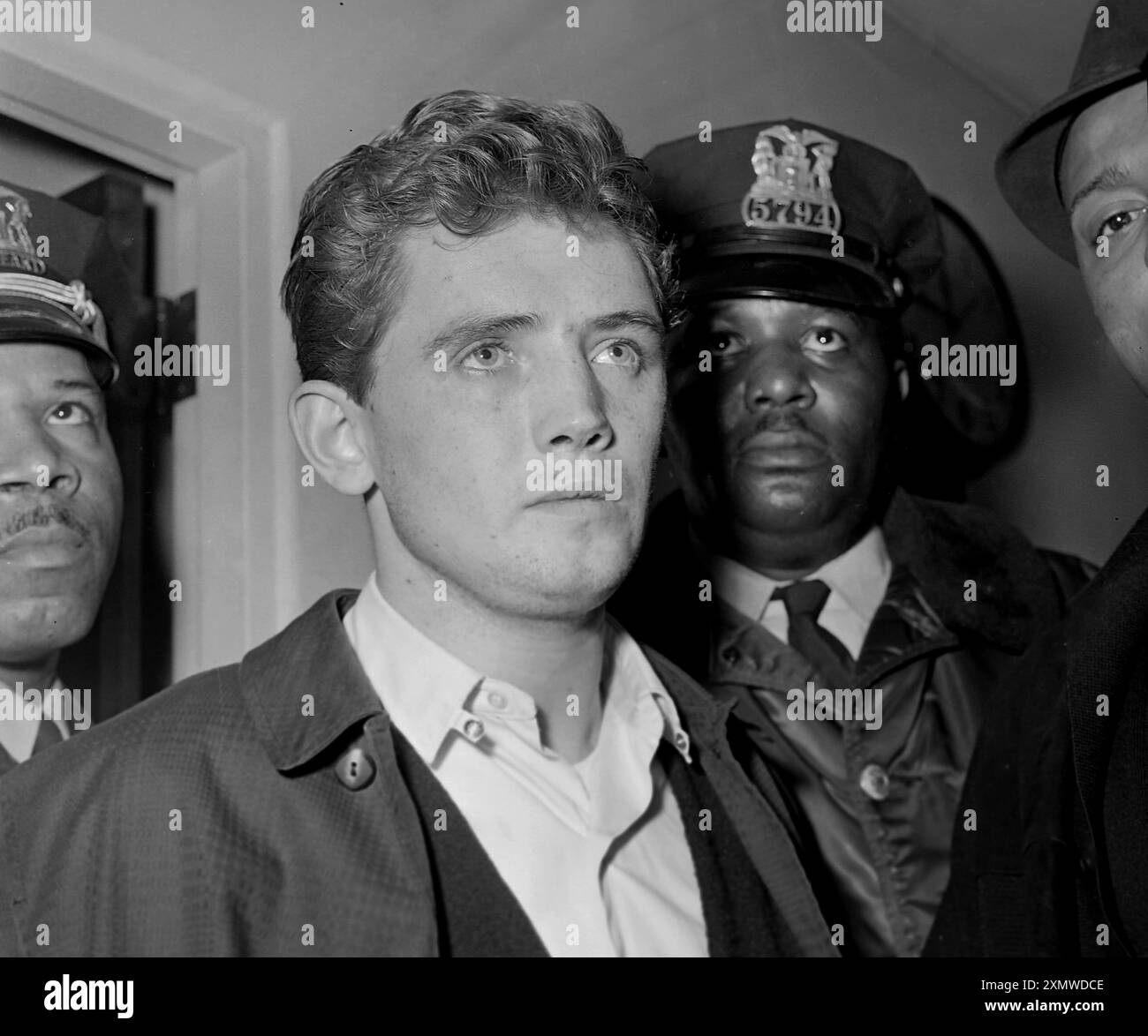 Suspect in a shooting is shown with Chicago police, ca. 1966 Stock ...