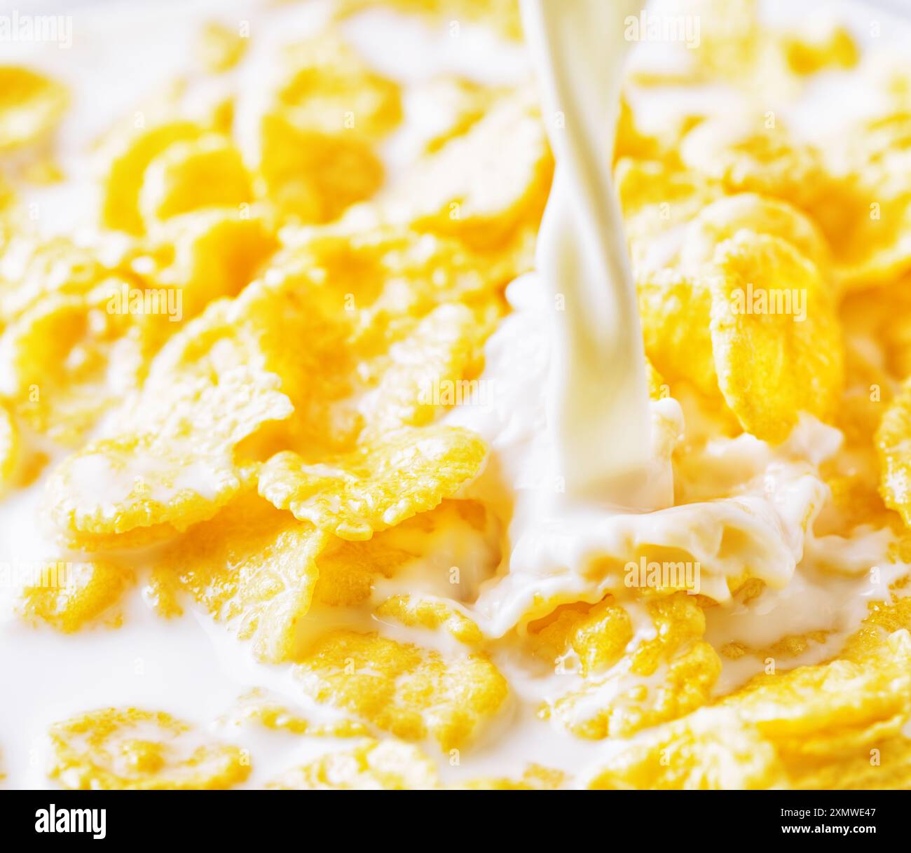 Milk pouring corn flakes hi-res stock photography and images - Alamy