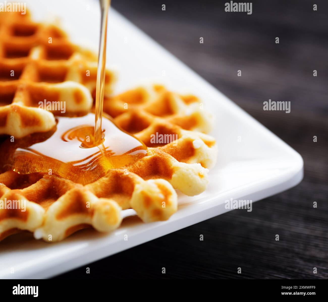 Honey pouring on waffles hi-res stock photography and images - Alamy