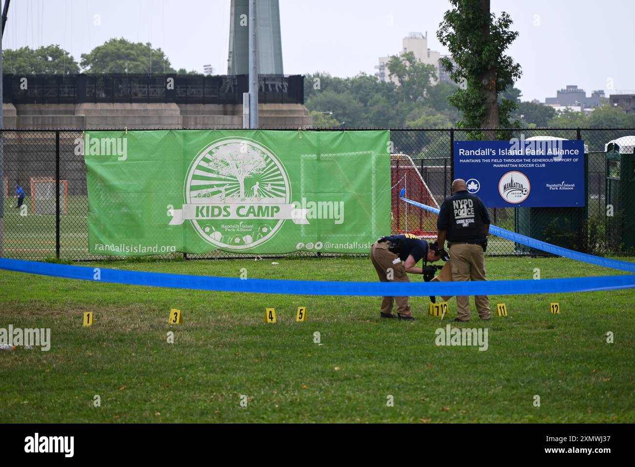 Crime scene investigators are canvassing the area and placing evidence ...