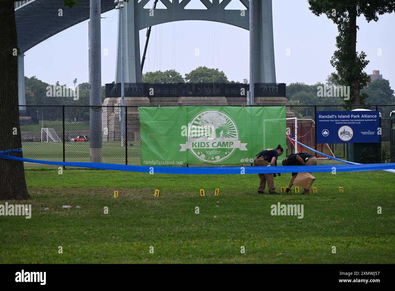 Crime scene investigators are canvassing the area and placing evidence ...