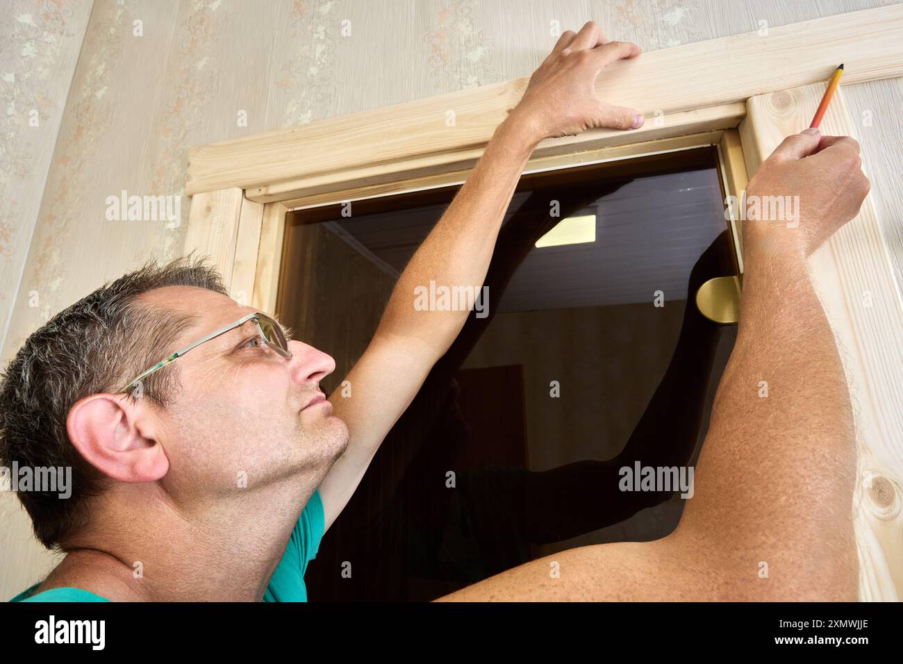 Door frame marking before jamb and trim installing Stock Photo - Alamy