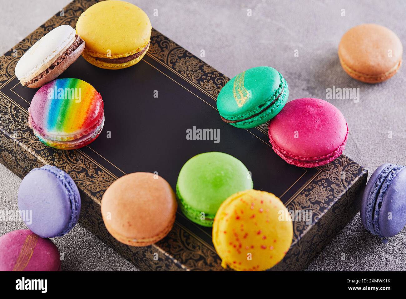 Variety of colorful macarons placed on an elegant decorative box ...