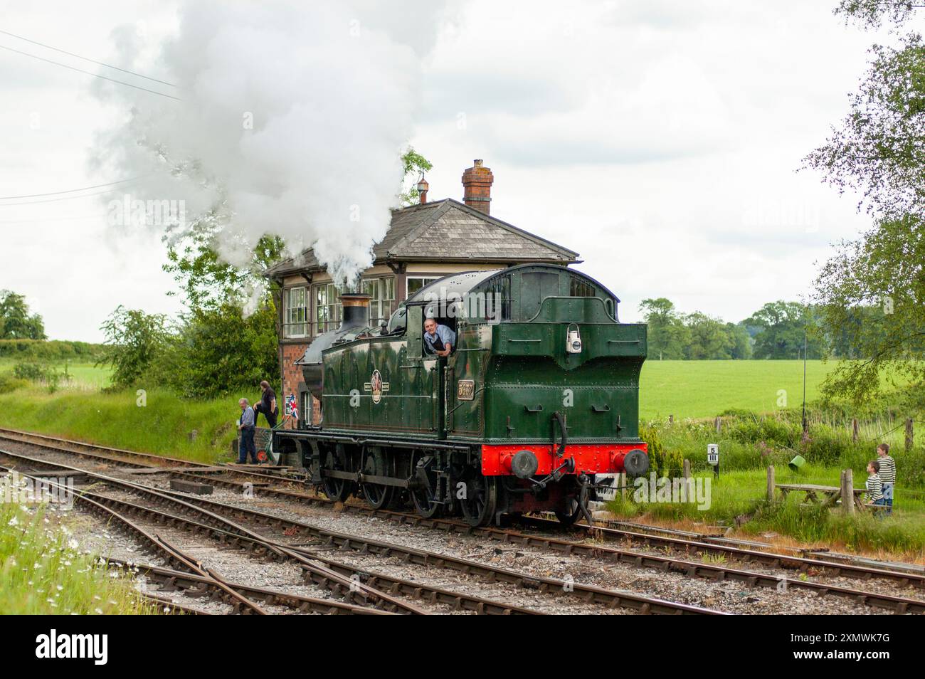Steam locomotive and a signal box Stock Photo - Alamy
