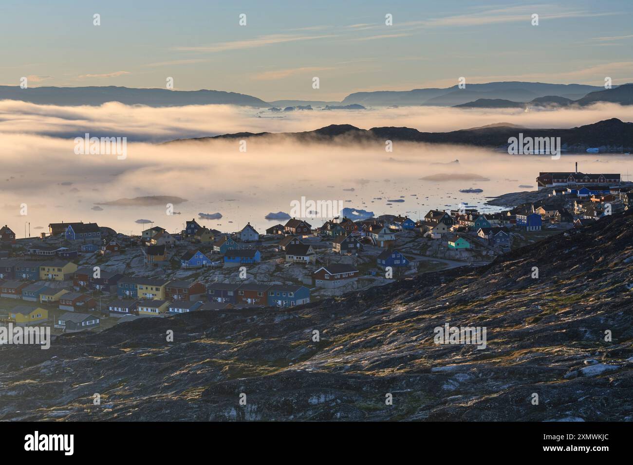 Inuit settlement, village, houses, midnight sun, icebergs, backlight ...