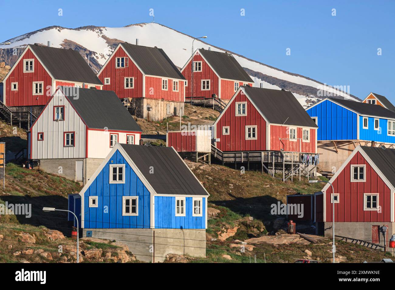 Typical Greenlandic Houses At The Coast Mountains Summer Sunny