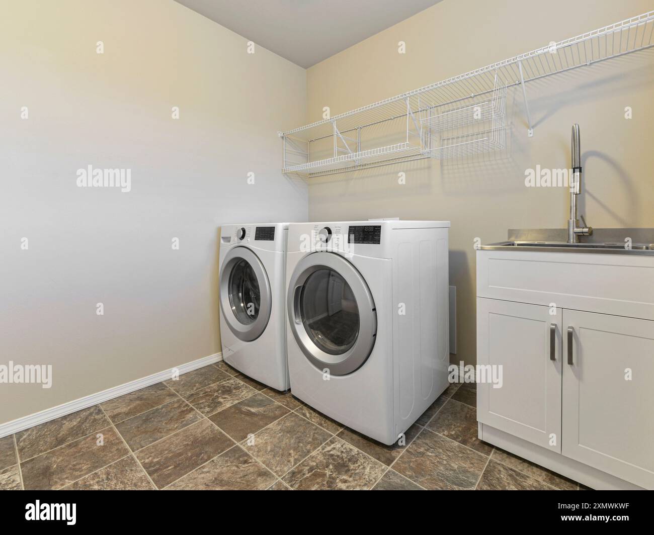 Modern residential laundry room interior Stock Photo - Alamy