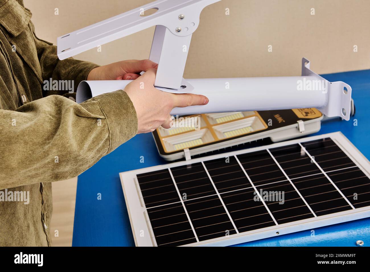 Solar panel and LED light are prepared for installation on mounting ...