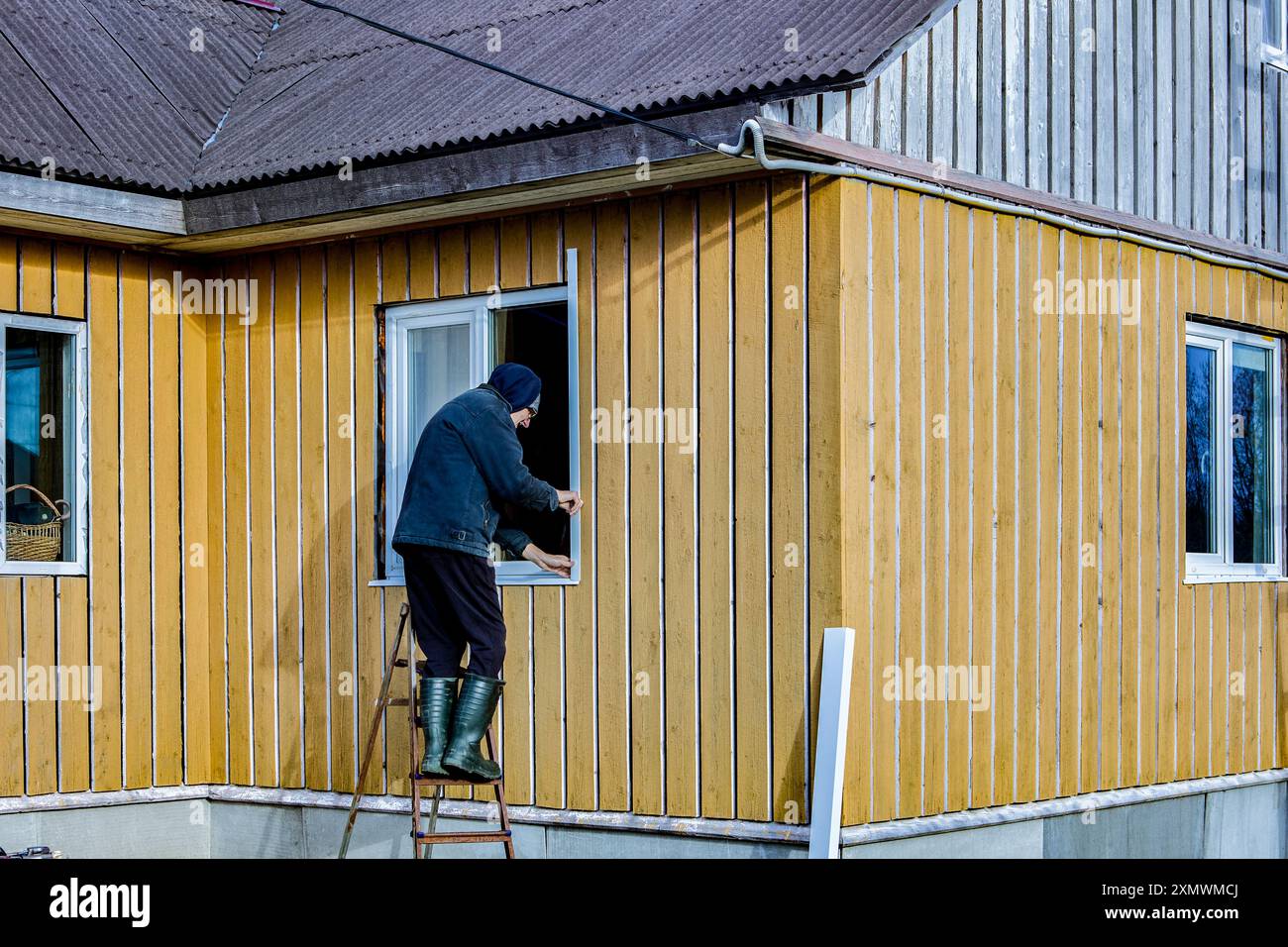 Installation of metal jambs and mouldings on plastic window on outside ...