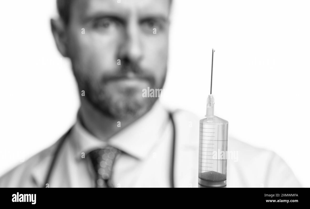Syringe with needle selective focus. Medical doctor holding syringe ...