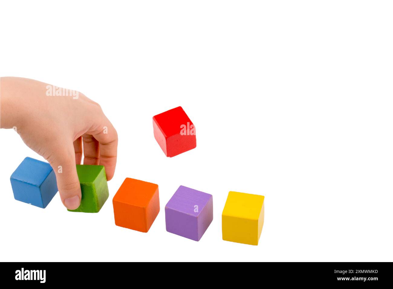 Hands playing and building with colorful wooden toy blocks. Early ...