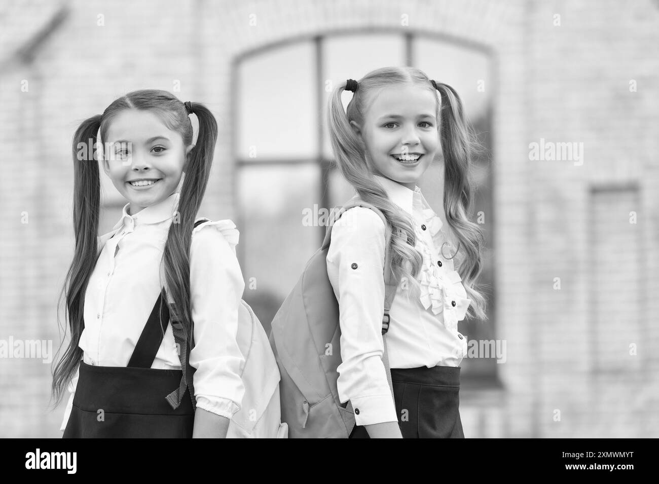 two school girls best friends smile together outdoor Stock Photo - Alamy