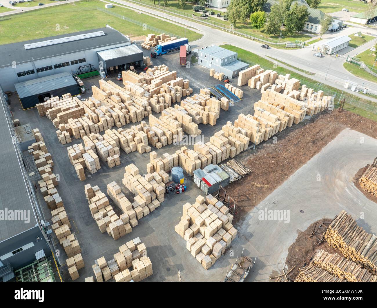 Wood sawmill, machinery for processing wood. Processing plant. A worker ...