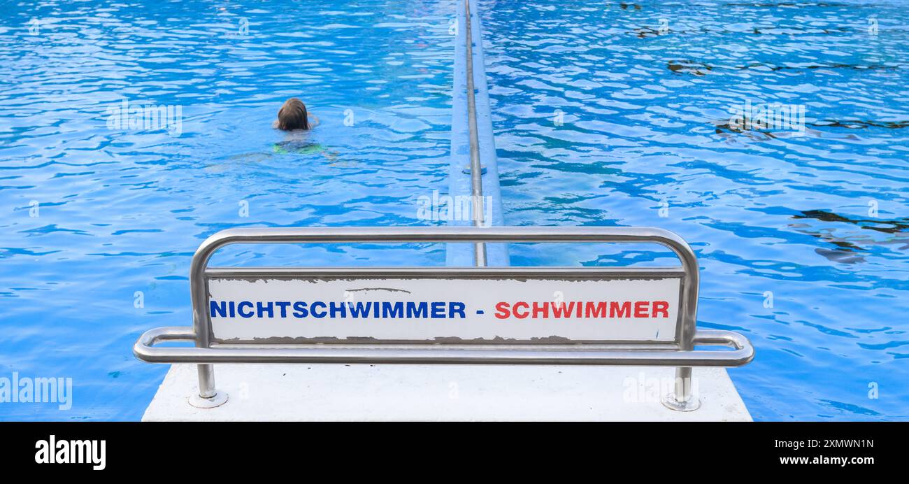 Hanover, Germany. 30th July, 2024. A sign "Non-swimmer - swimmer" can ...